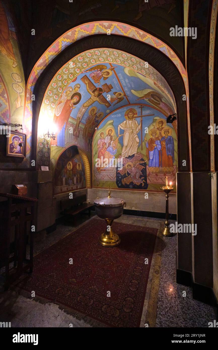 A Jesus mural, fresco scene in a side alcove. At the historic, stone ...