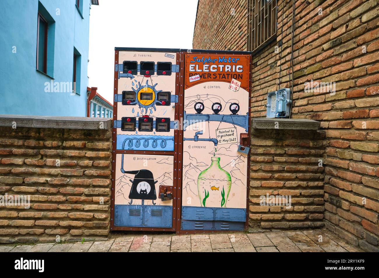 Two electrical utility boxes with a funny science experiment scene. One ...