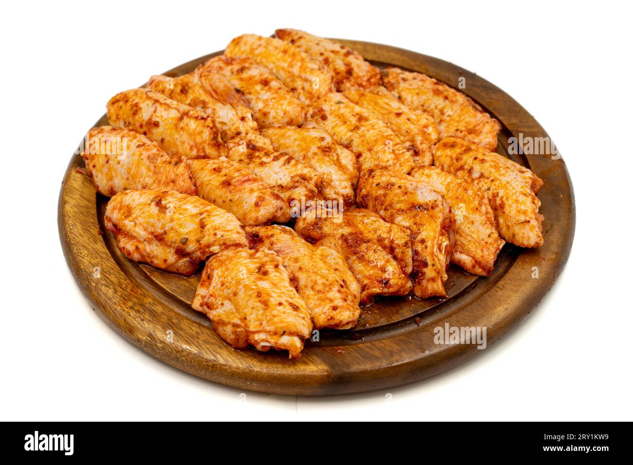 Chicken wings with sauce isolated on white background. Raw chicken ...