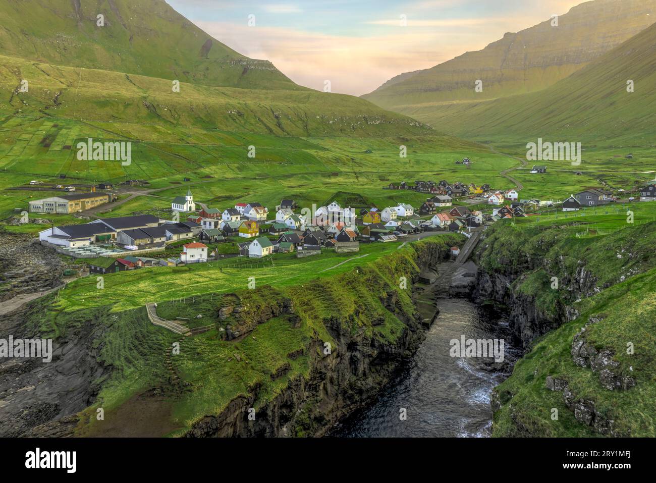 The village of Gjogv and its natural harbour in the Faroe Islands Stock ...
