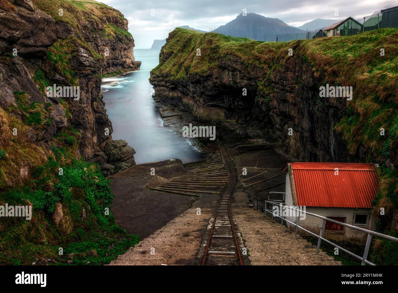 The village of Gjogv and its natural harbour in the Faroe Islands Stock ...
