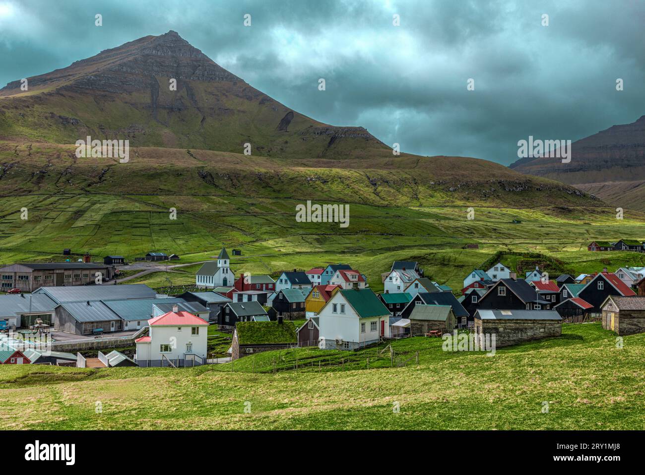 The village of Gjogv and its natural harbour in the Faroe Islands Stock ...