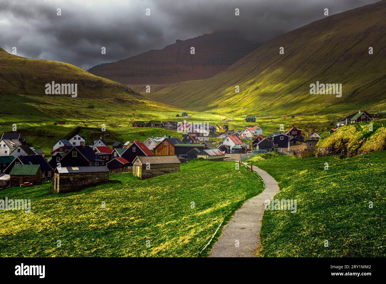 The village of Gjogv and its natural harbour in the Faroe Islands Stock ...