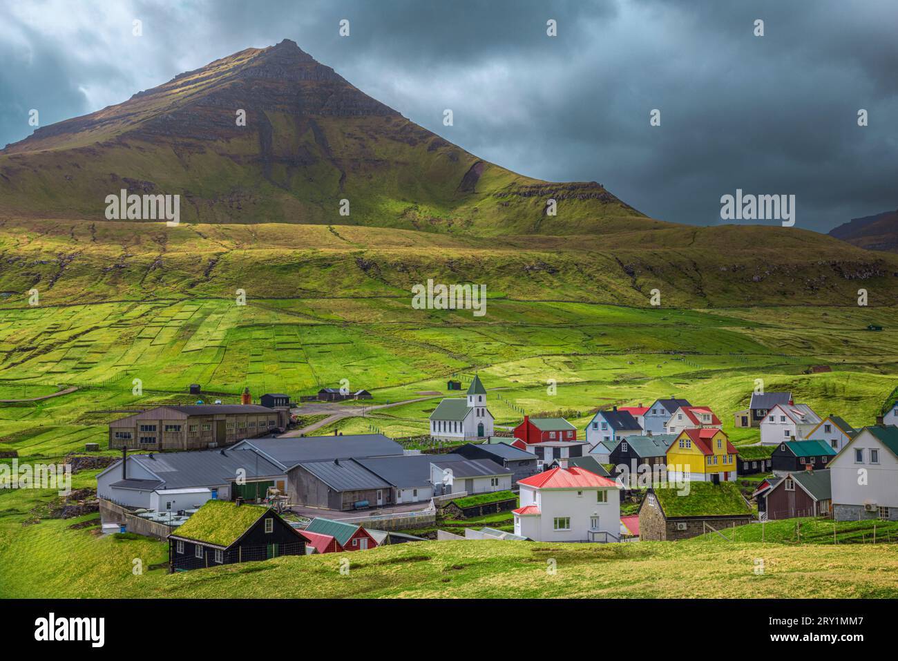 The village of Gjogv and its natural harbour in the Faroe Islands Stock ...