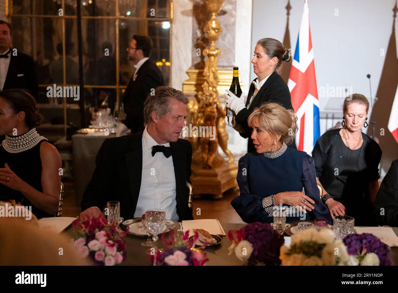 Brigitte Macron and Hugh Grant attending a State Banquet at the Chateau ...