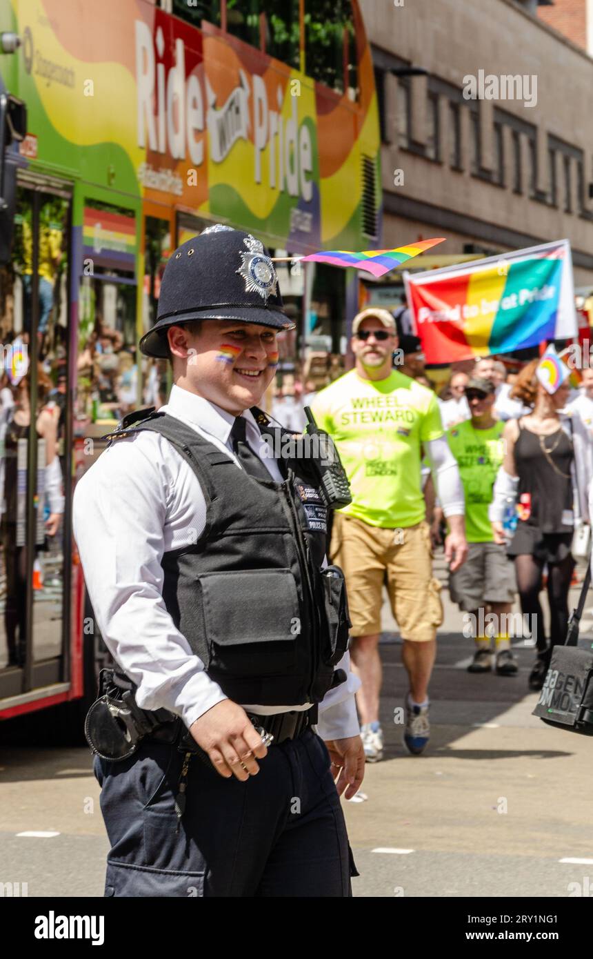 Police officer with rainbow face paint at Pride in London, LGBT+ ...