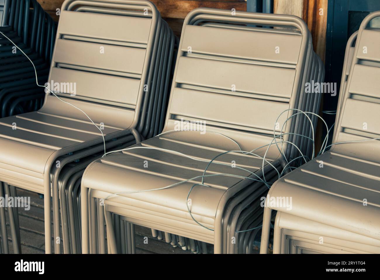 Chairs attached to a closed bar Stock Photo - Alamy