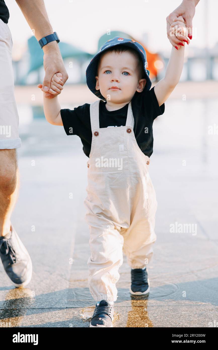Father son hold hands walk hi-res stock photography and images - Alamy
