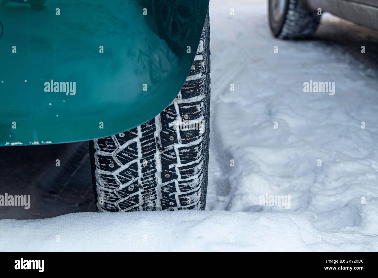 closeup of winter wheels on white snow. green bumper and tires Stock ...
