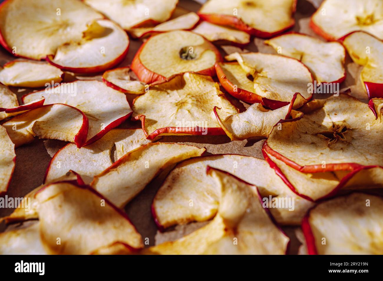 Dried apples cut into slices in sun to dry Stock Photo - Alamy