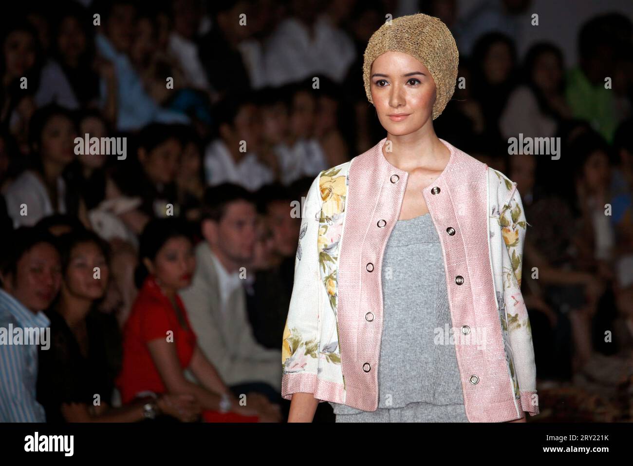 Attractive Female Asian Model Posing On Catwalk At Elle Fashion Show