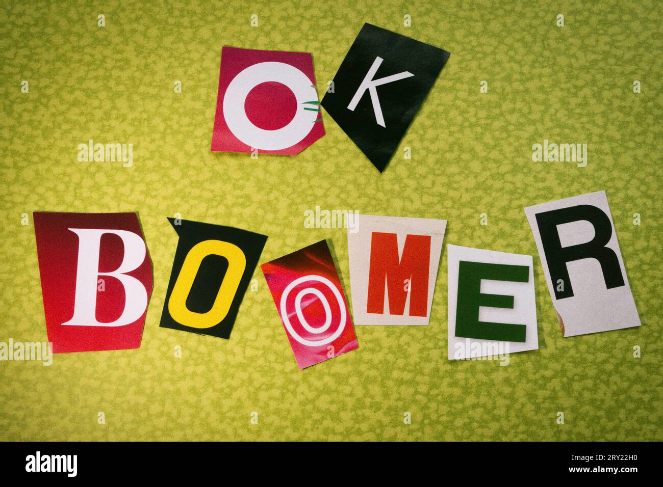 The expression "OK BOOMER" slang using cut-out paper letters in the ...