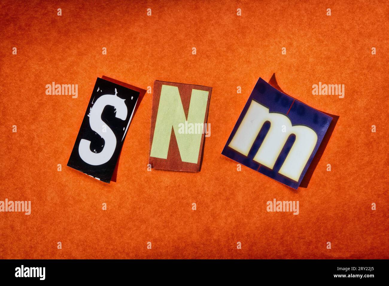The acronym "SNM" slang using cut-out paper letters in the ransom note ...