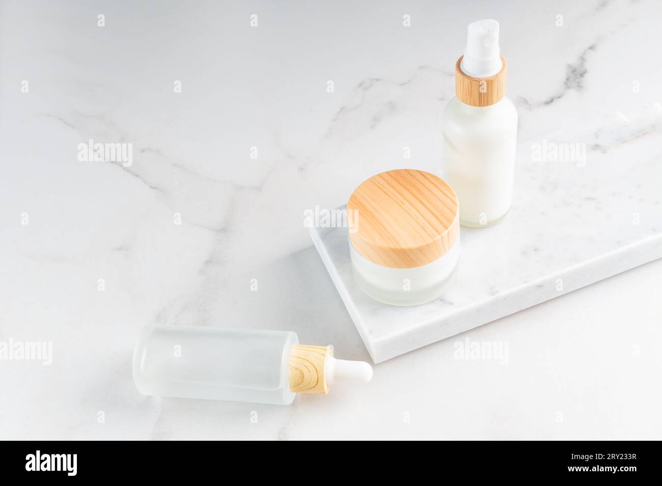 three unbranded matte glass cosmetic bottles for skin care products ...