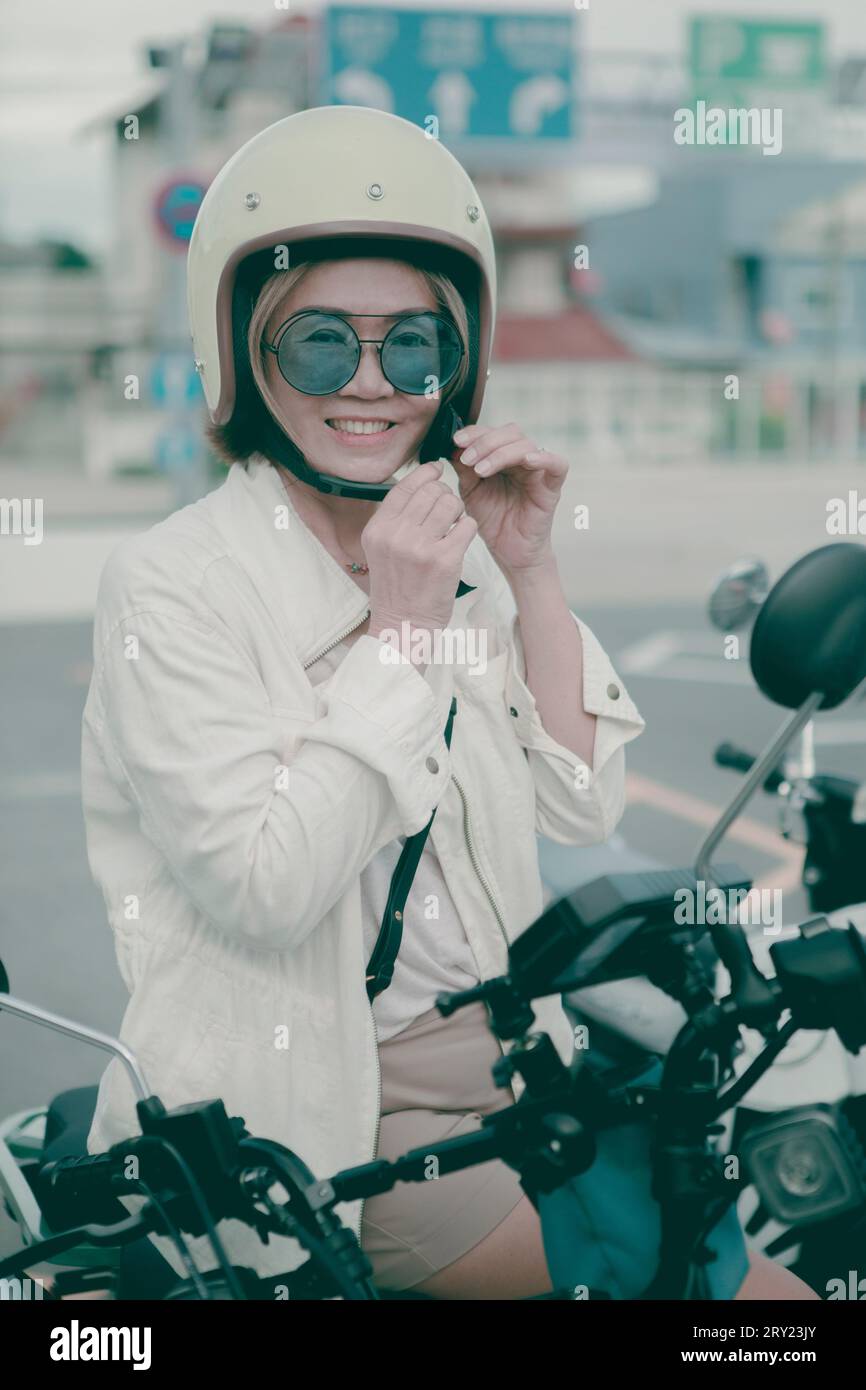 woman wearing safety helmet standing on city road toothy smile with ...