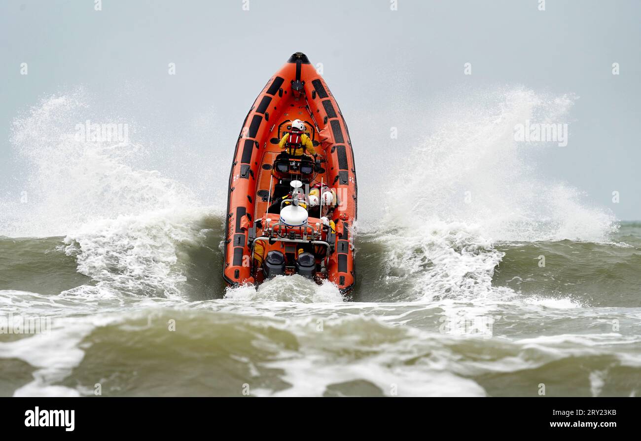 An RNLI Lifeboat crashes through waves during a multi-agency exercise ...