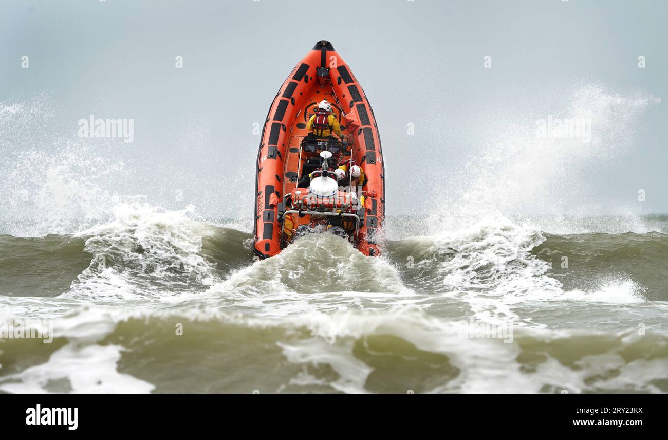 An RNLI Lifeboat crashes through waves during a multi-agency exercise ...