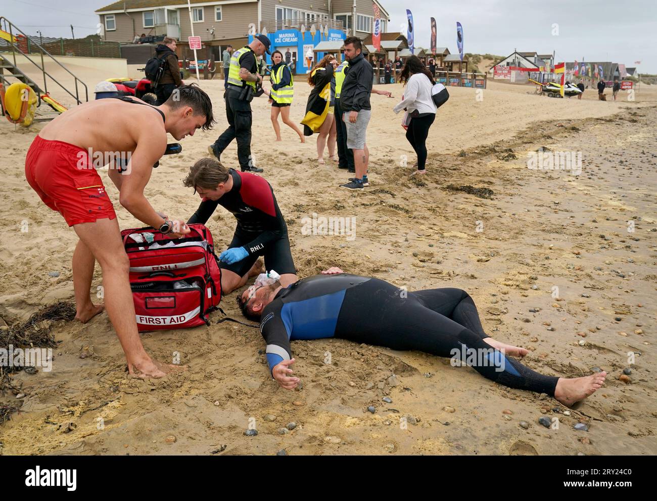 RNLI Lifeguards practice their skills on an actor during a multi-agency ...