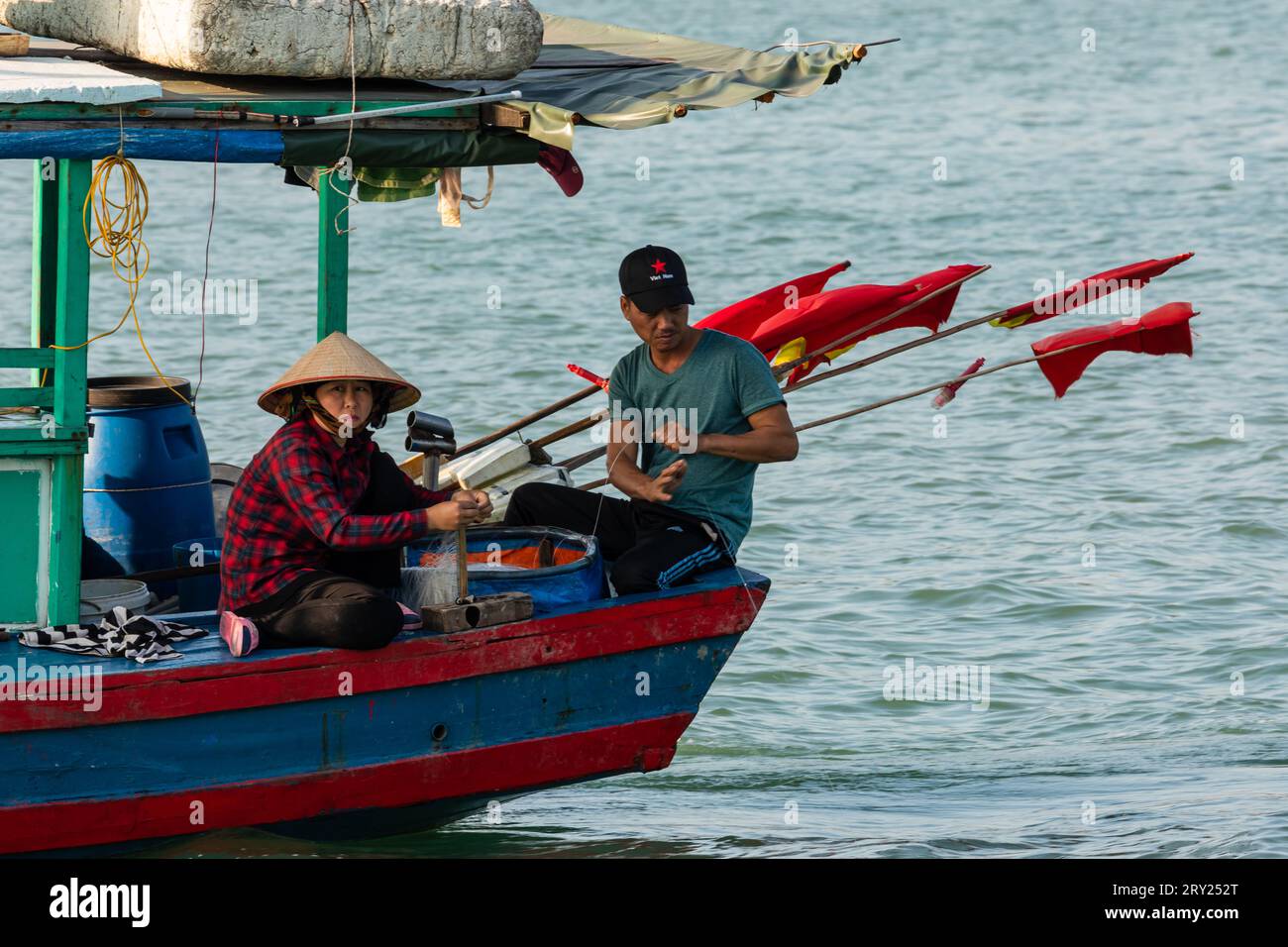 Fishing people in the Ha Long Bay of Vietnam Stock Photo - Alamy
