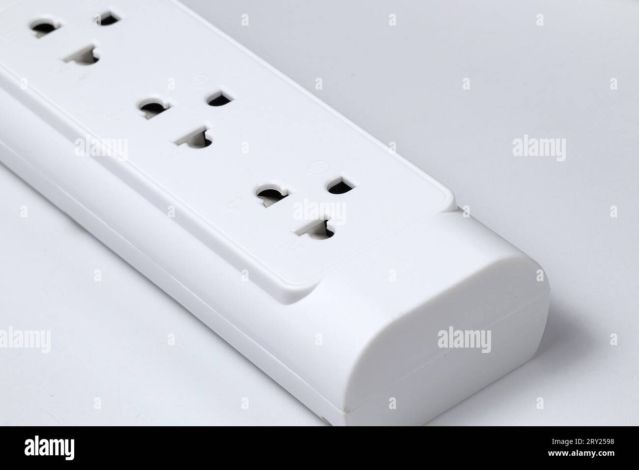 Closeup of electrical power strip or extension block on white ...
