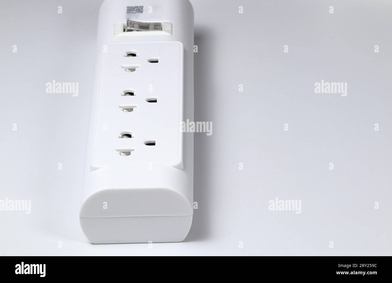Closeup of electrical power strip or extension block on white ...