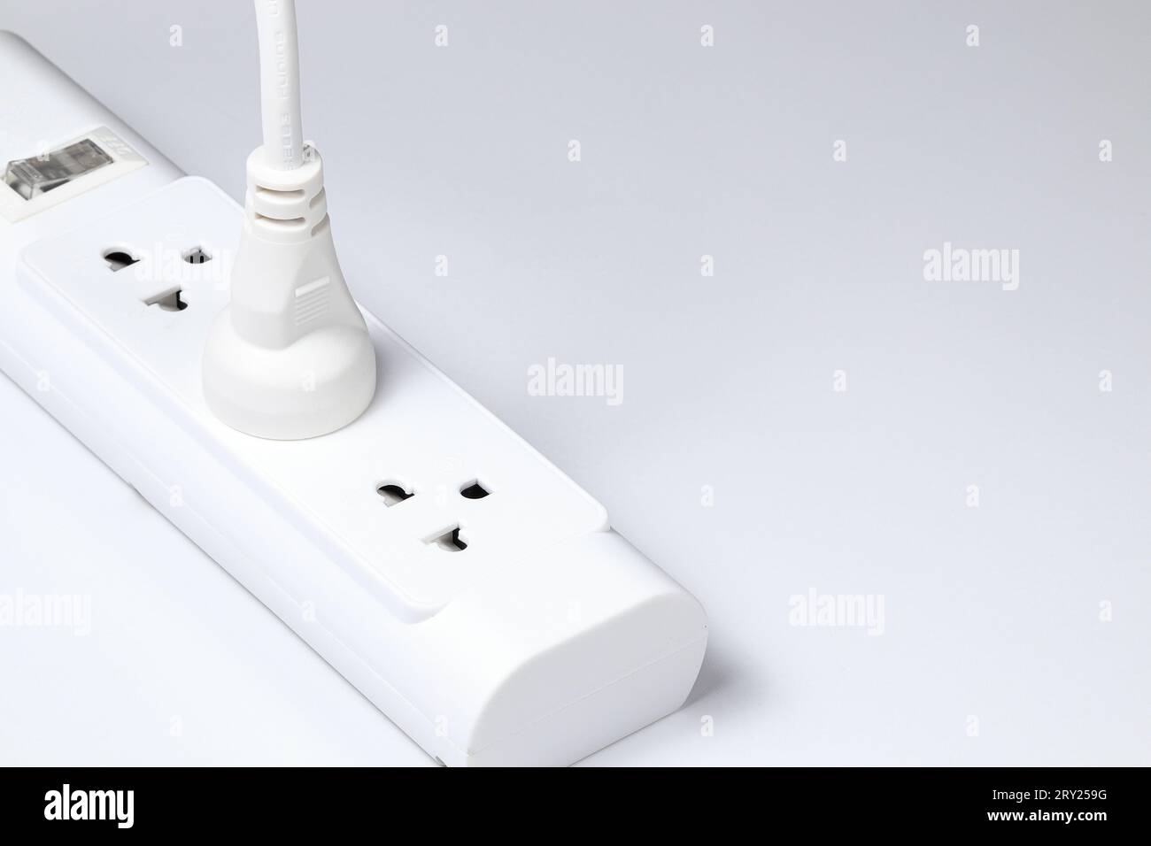 Closeup of electrical power strip or extension block on white ...