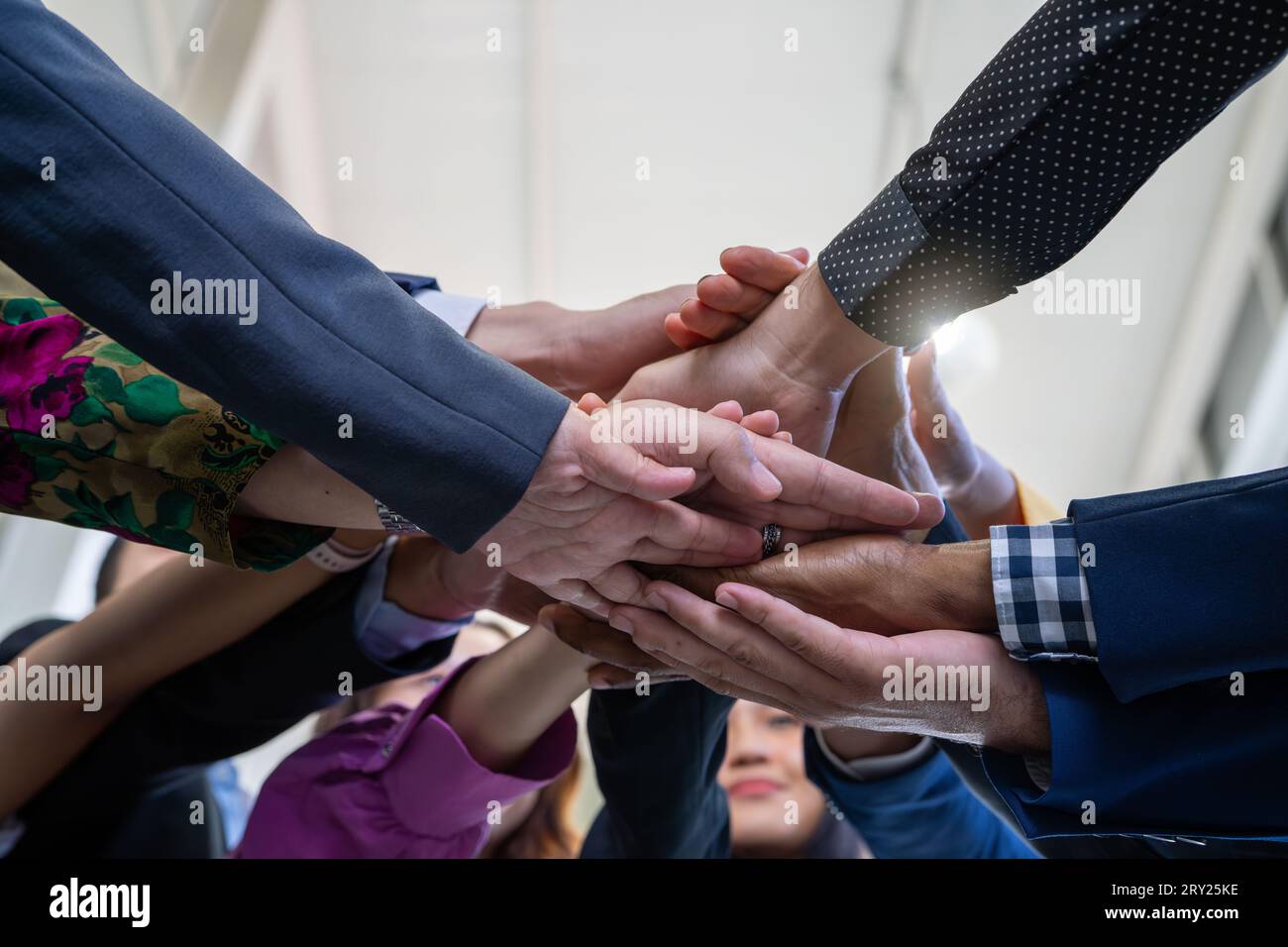 Team, teamwork, and unity concept. Diverse team putting hands together ...