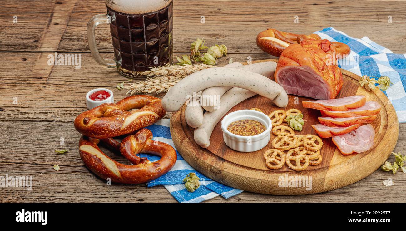 Traditional Oktoberfest set. Pretzels, beer, weisswurst and eisbein ...