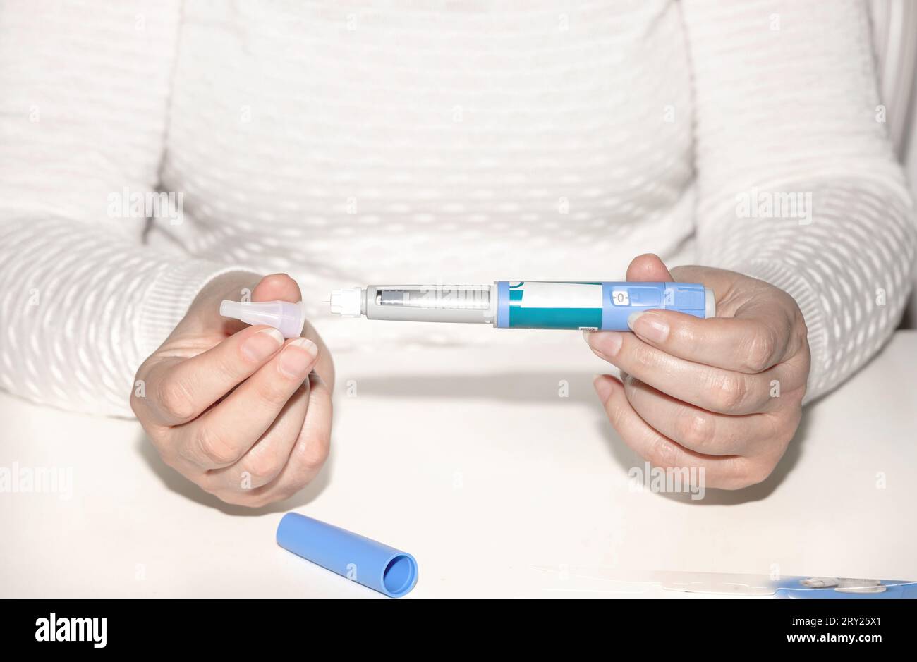 Female hands holding an insulin pen. Ozempic Insulin injection pen or ...