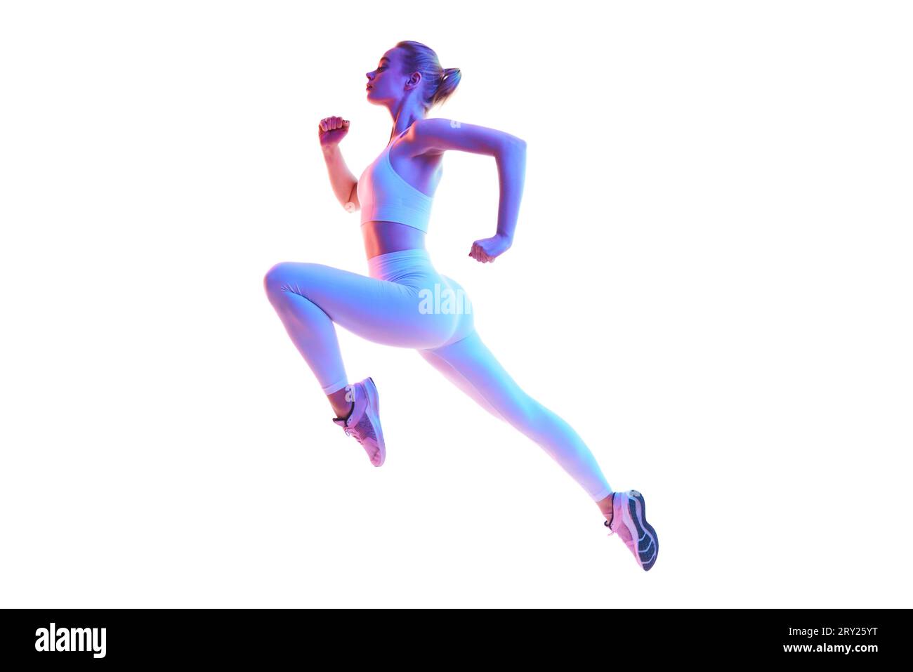 Side view portrait of young sportive woman running in action isolated ...