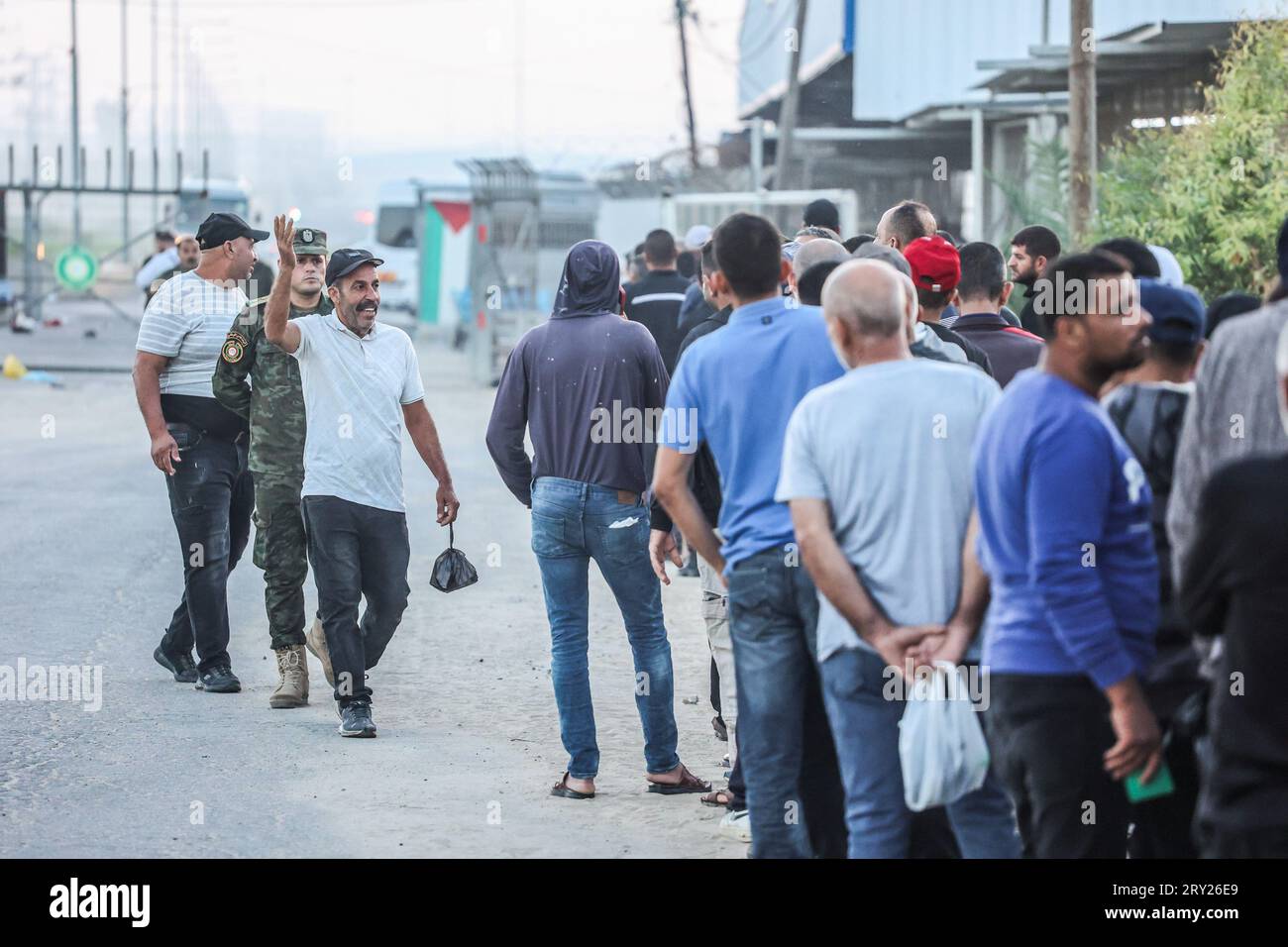 Palestinian workers gather at the Erez crossing between Israel and the ...