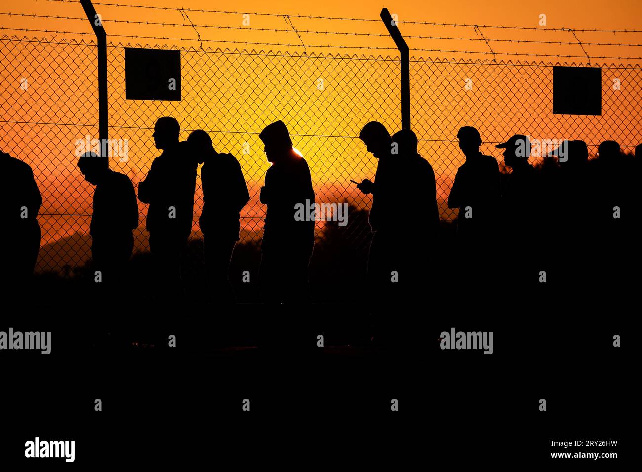 Palestinian workers gather at the Erez crossing between Israel and the ...