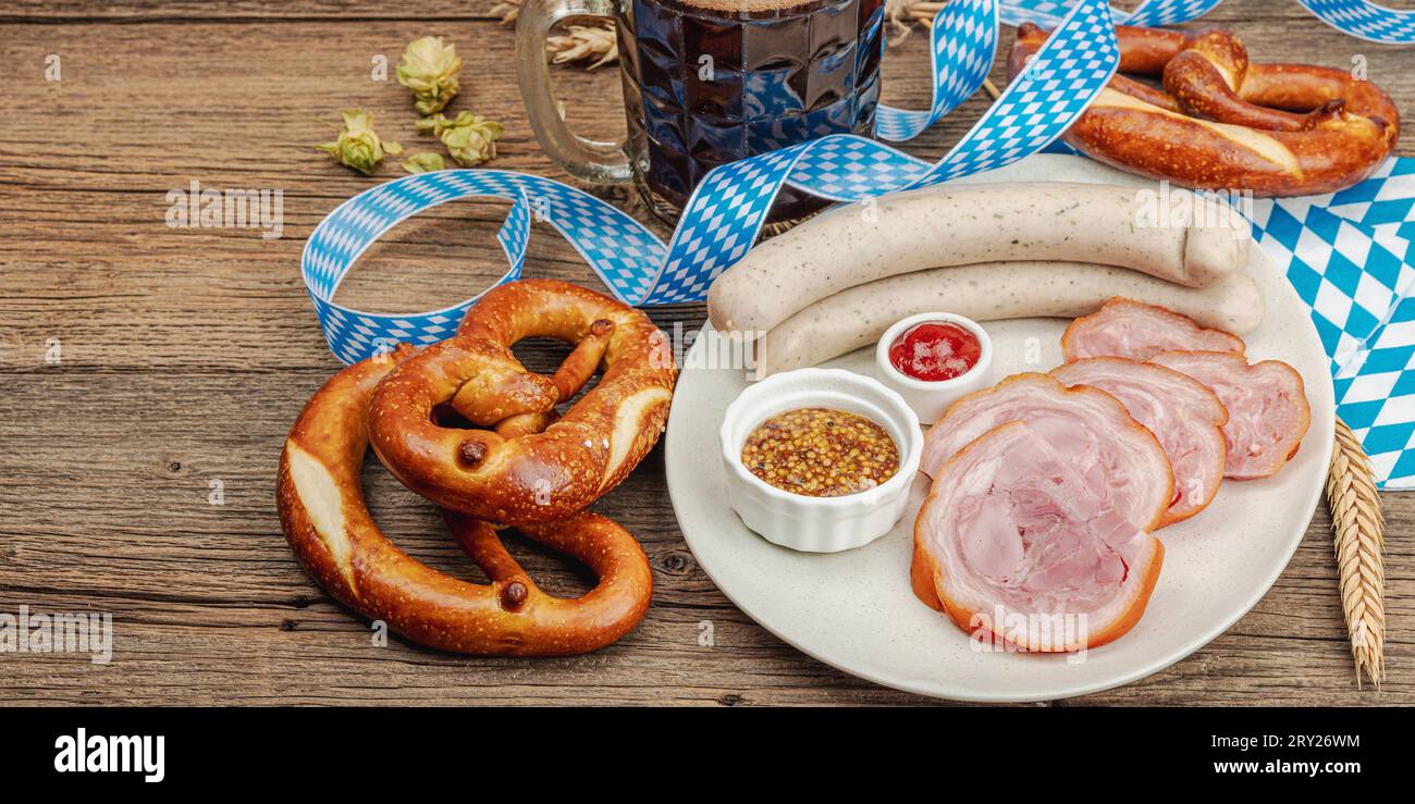 Traditional Oktoberfest set. Pretzels, beer, weisswurst and eisbein ...