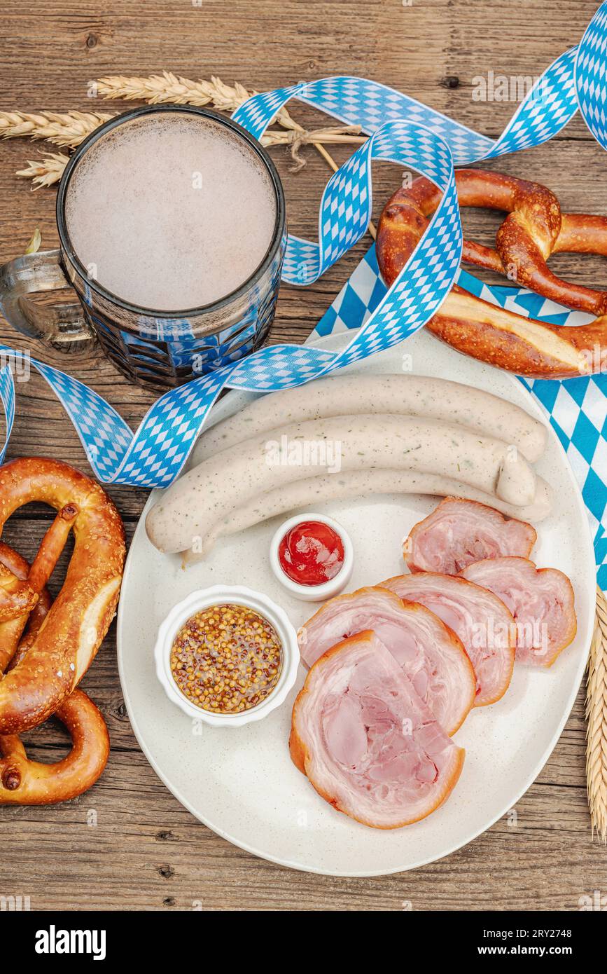 Traditional Oktoberfest set. Pretzels, beer, weisswurst and eisbein ...