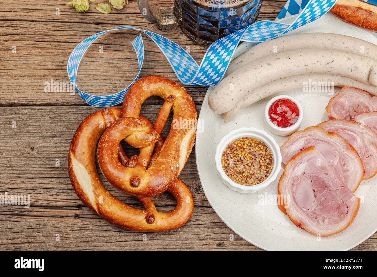 Traditional Oktoberfest set. Pretzels, beer, weisswurst and eisbein ...