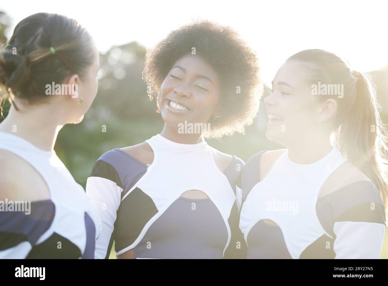 Cheerleader, sports and women on field smile for performance, dance and ...