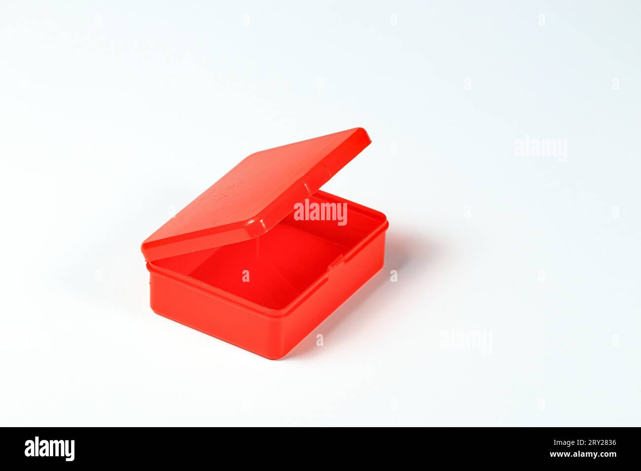 Open empty small red plastic box isolated on white background Stock ...