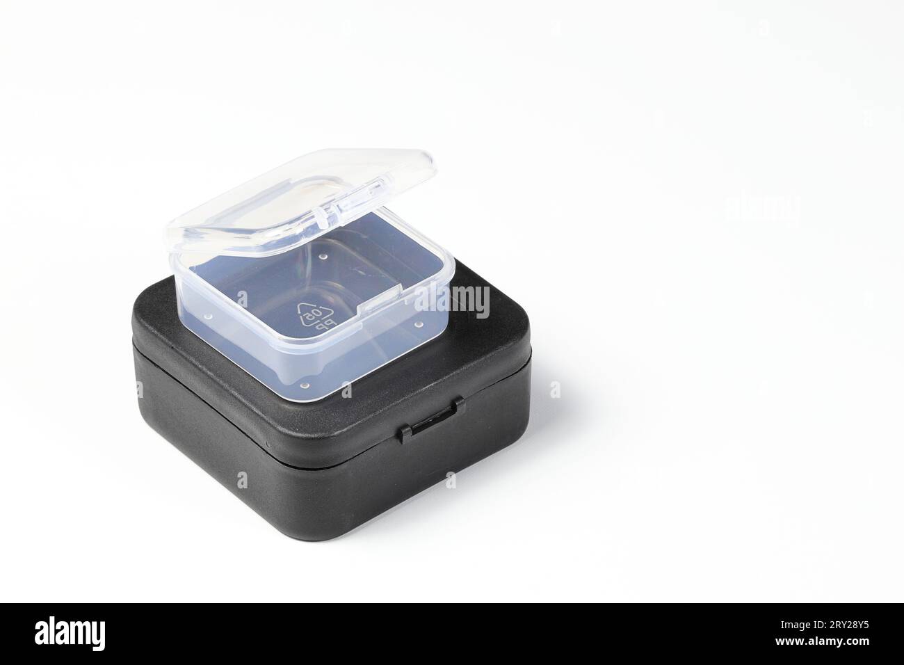 Empty small transparent and black plastic box isolated on white ...