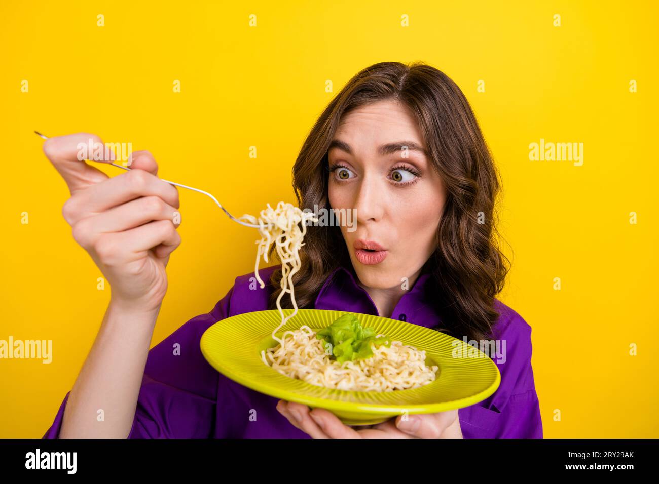 Photo of impressed hungry girl look arm hold spaghetti pasta fork plate ...