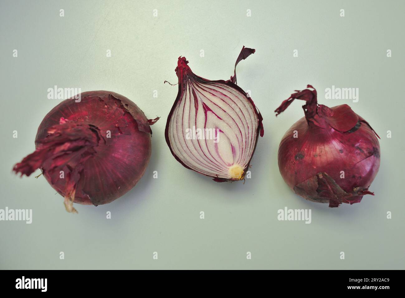 Three Red Onions Stock Photo - Alamy