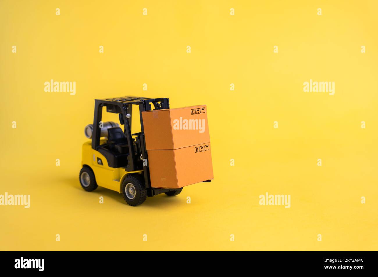 Forklift transports boxes. Warehouses, manufacturing facilities, and ...
