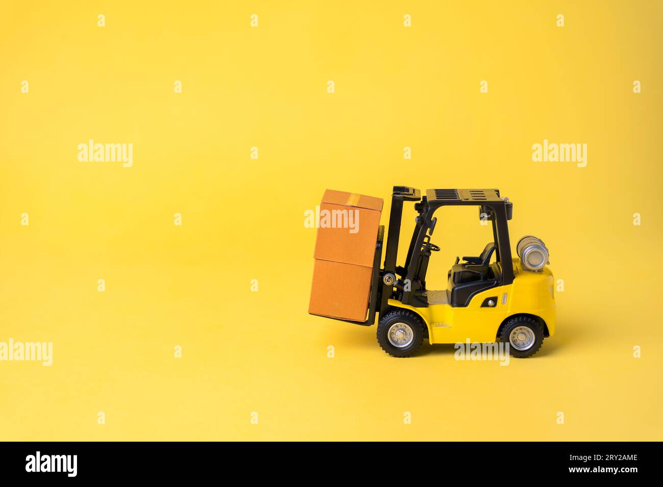 Forklift loading boxes Stock Photo - Alamy