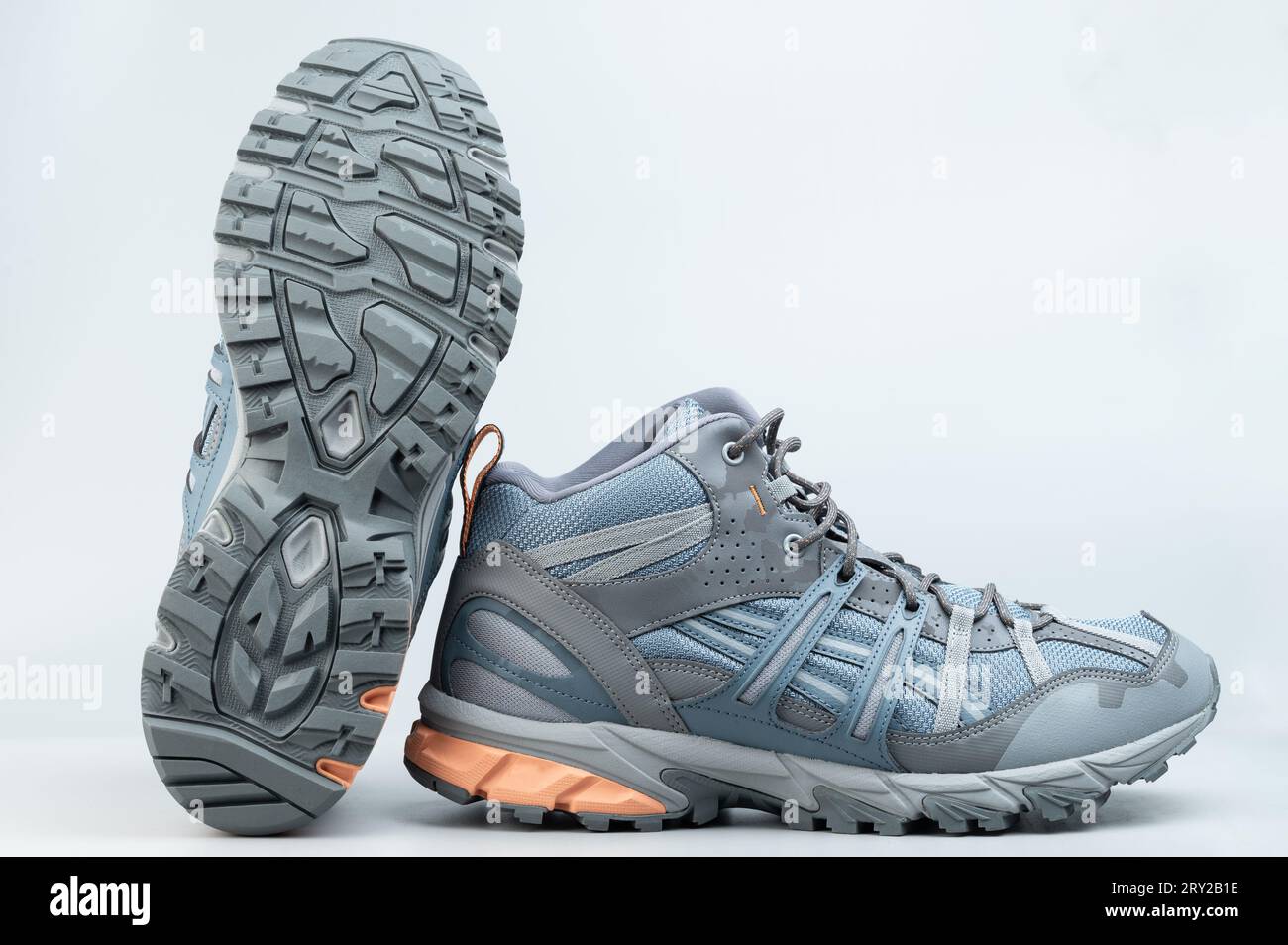 Strong pair shoes for outdoor adventure isolated on grey studio ...