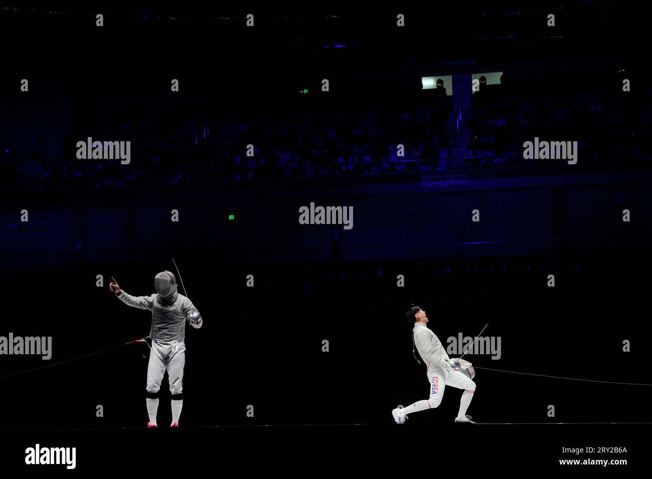 Gu Bongil of South Korea, right, and Yan Yinghui, of China reacts in ...