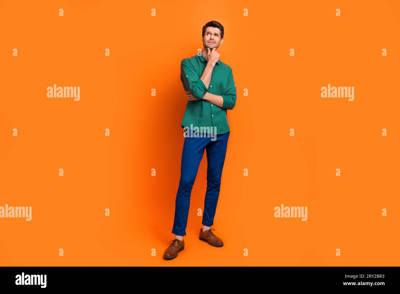 Full length cadre of make decision smart young man wear green shirt ...