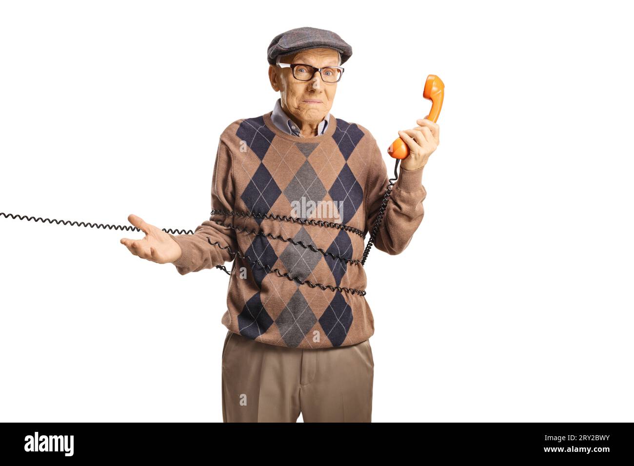 Scared elderly man tangled in a cable from a vintage rotary phone ...