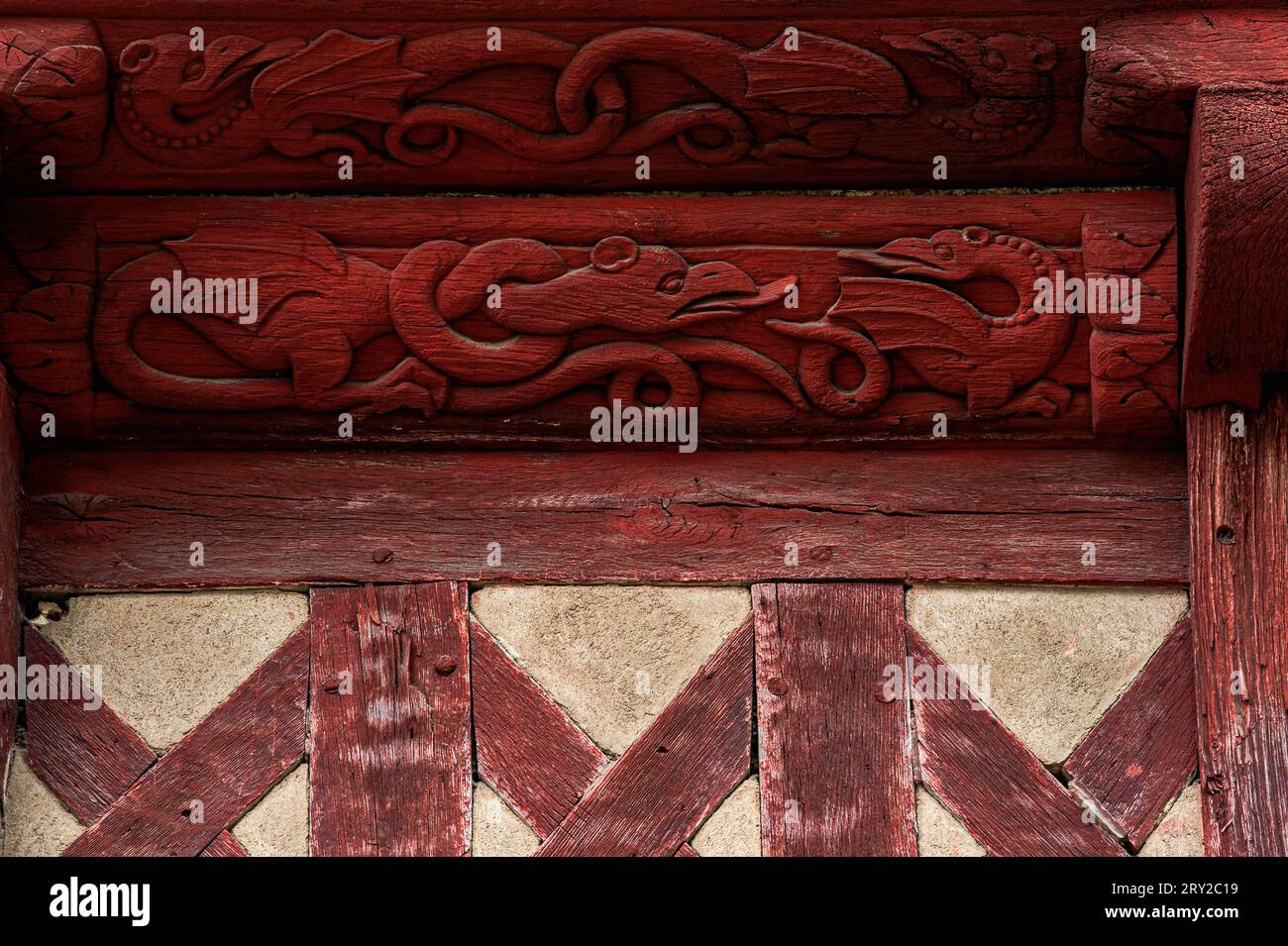 Two bird-like creatures with large beaks and long tongues. Carved in ...