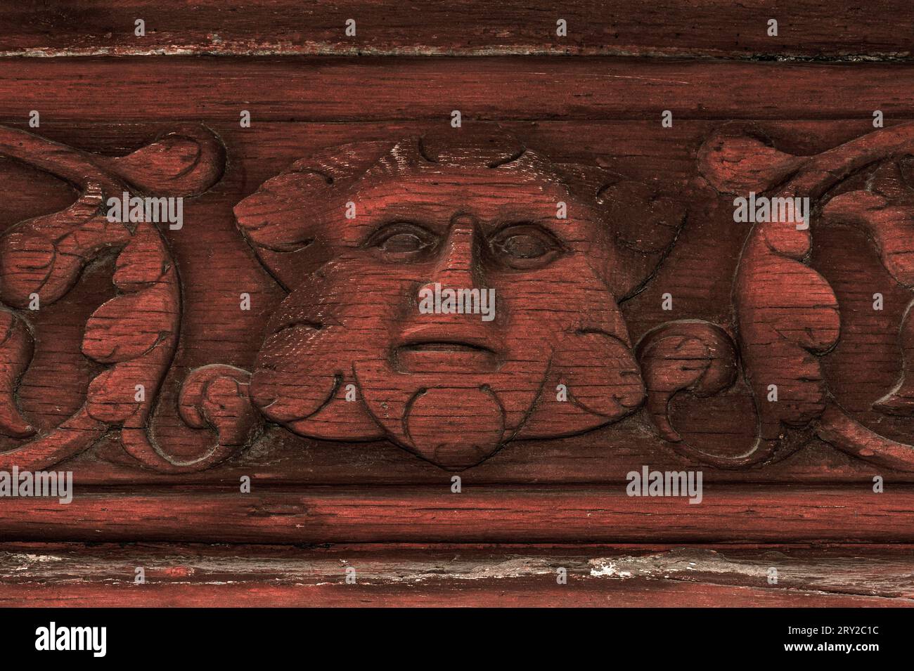 Human face and foliage. Carved in bas-relief on lower bressumer or load ...