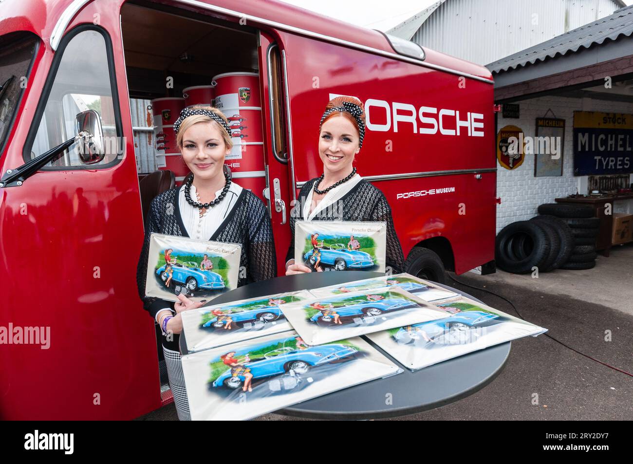 Promotional girls promoting Porsche memorabilia at the Goodwood Revival ...
