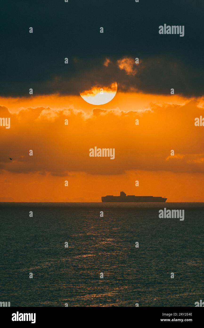 Amazing view of boat floating and on still seawater against cloudy ...